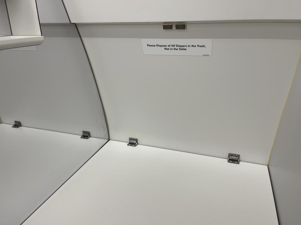 The Best Way to Change a Diaper on an Airplane (and a Simple Trick)